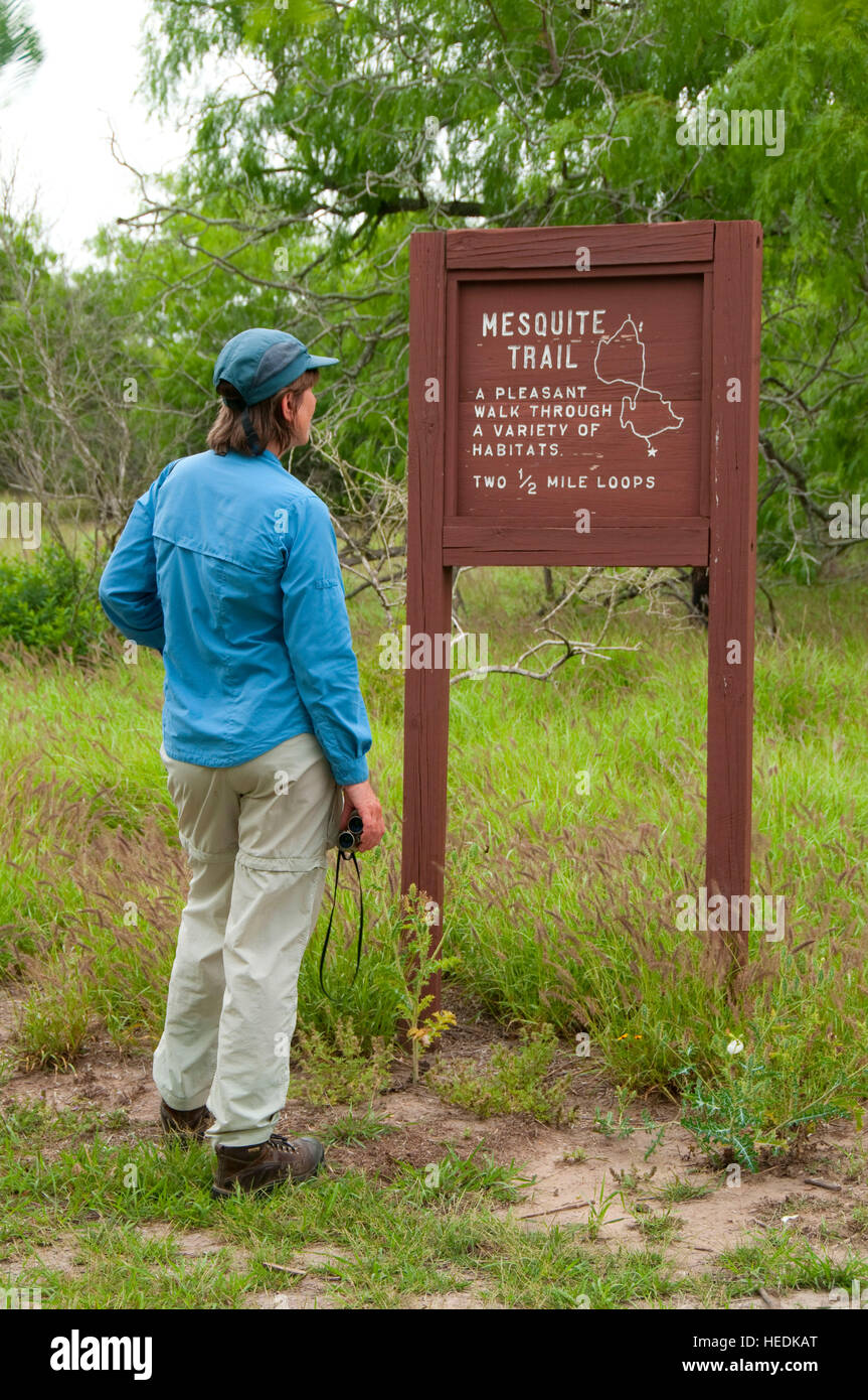 Hiker with Mesquite Trail sign, Laguna Atascosa National Wildlife ...