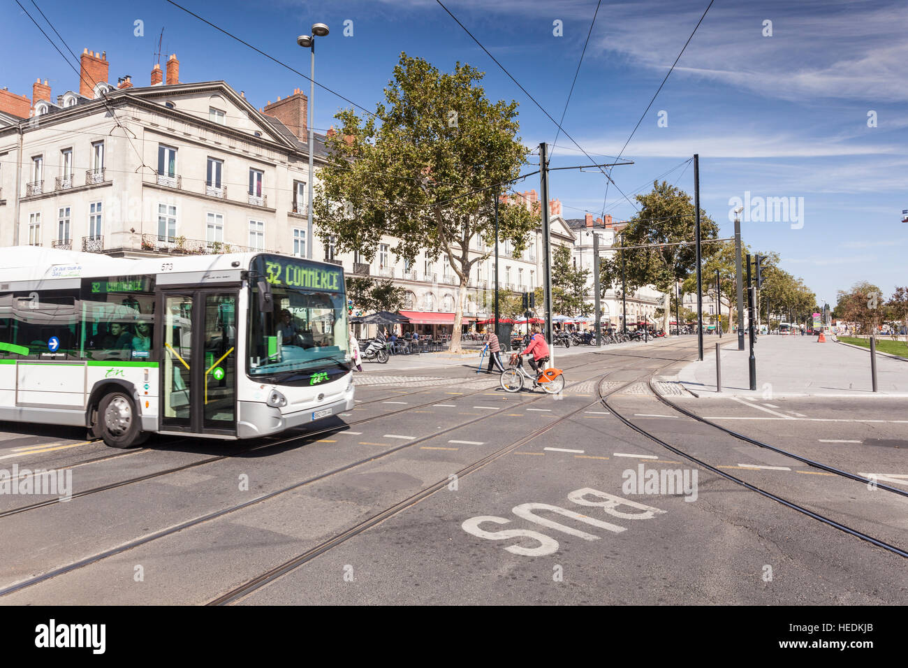 A bus passes through tram system in the city of Nantes in France Stock ...