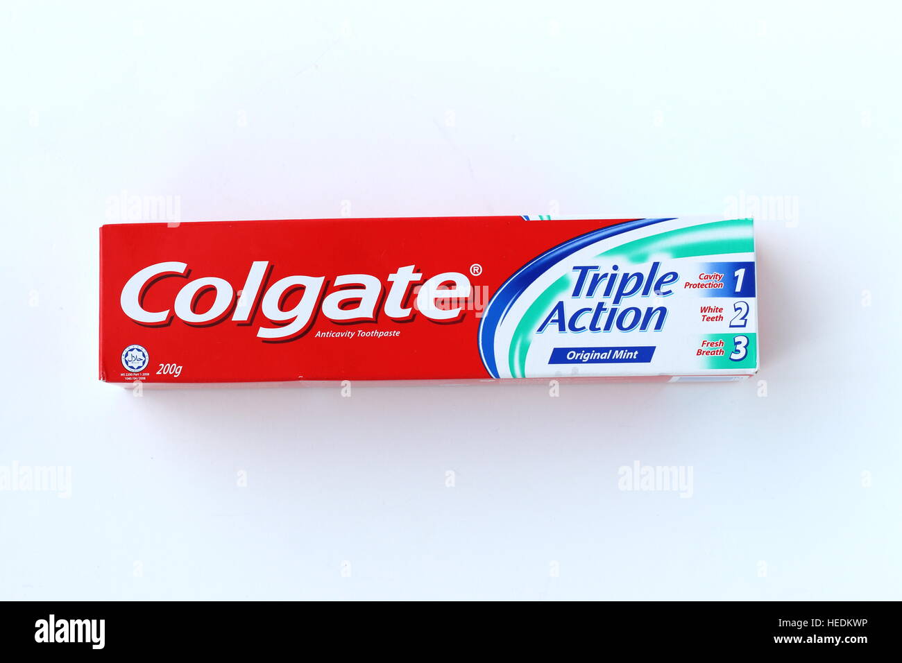 Colgate Triple Action Toothpaste isolated against white background ...