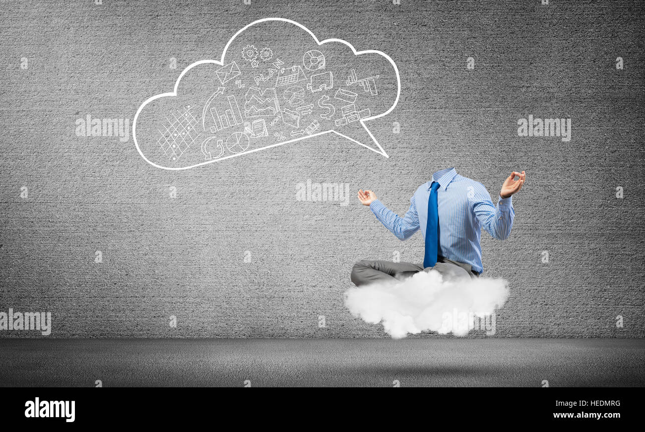 Headless businessman meditating Stock Photo - Alamy