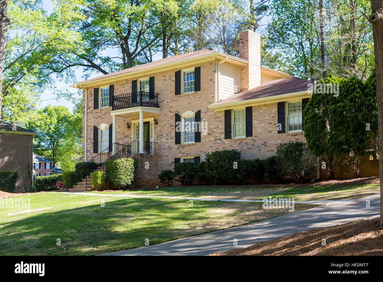 Light Brick Home with Steps on hill Stock Photo - Alamy