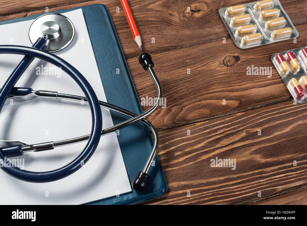 Desk of doctor with medicine things Stock Photo - Alamy
