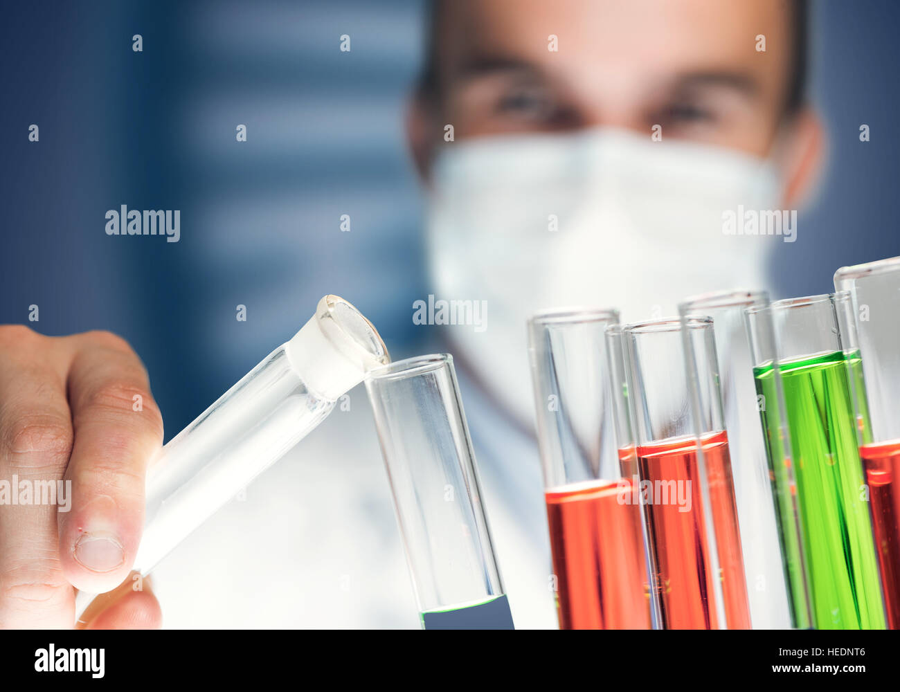 Portrait of concentrated male scientist working with reagents in laboratory Stock Photo - Alamy
