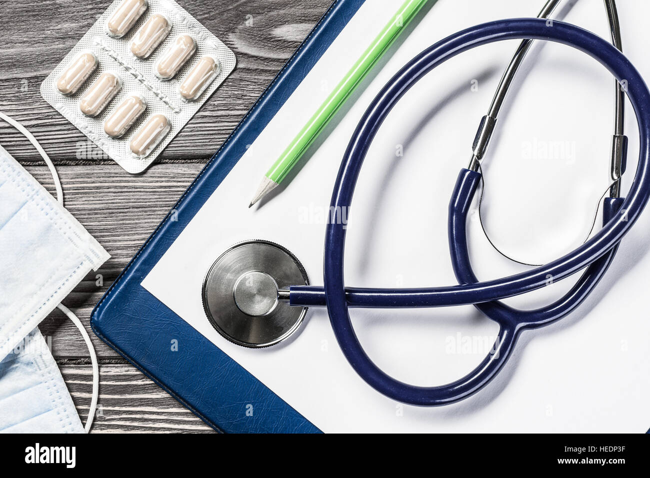 Desk of doctor with medicine things Stock Photo - Alamy