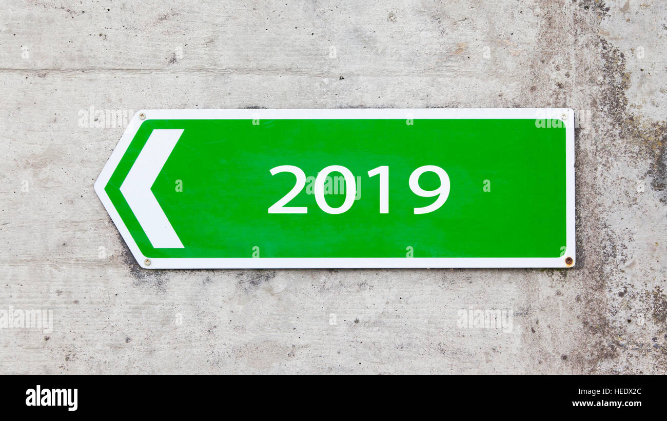 Green sign on a concrete wall - New year - 2019 Stock Photo - Alamy