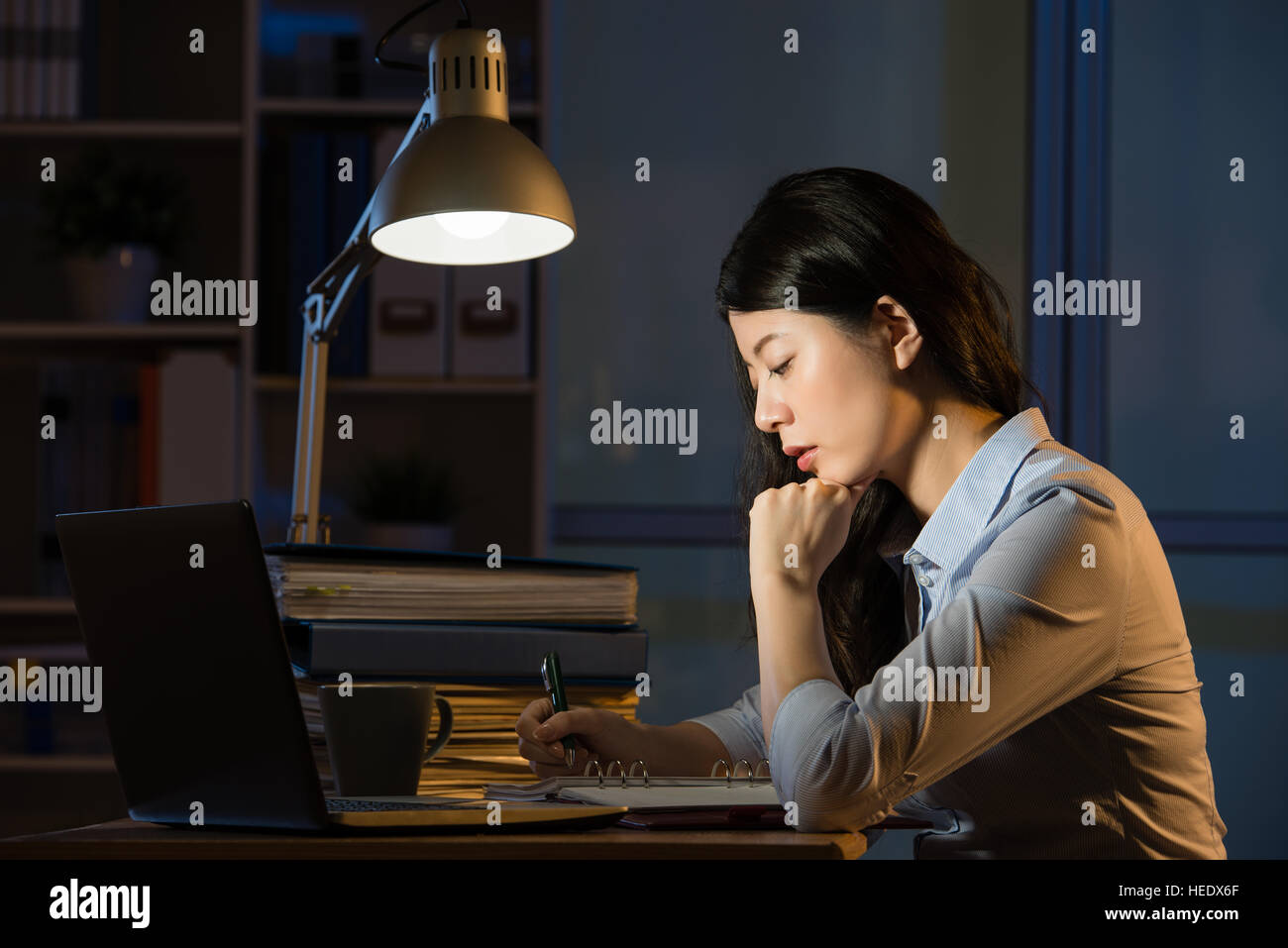 asian business woman sitting at desk working use laptop overtime late ...