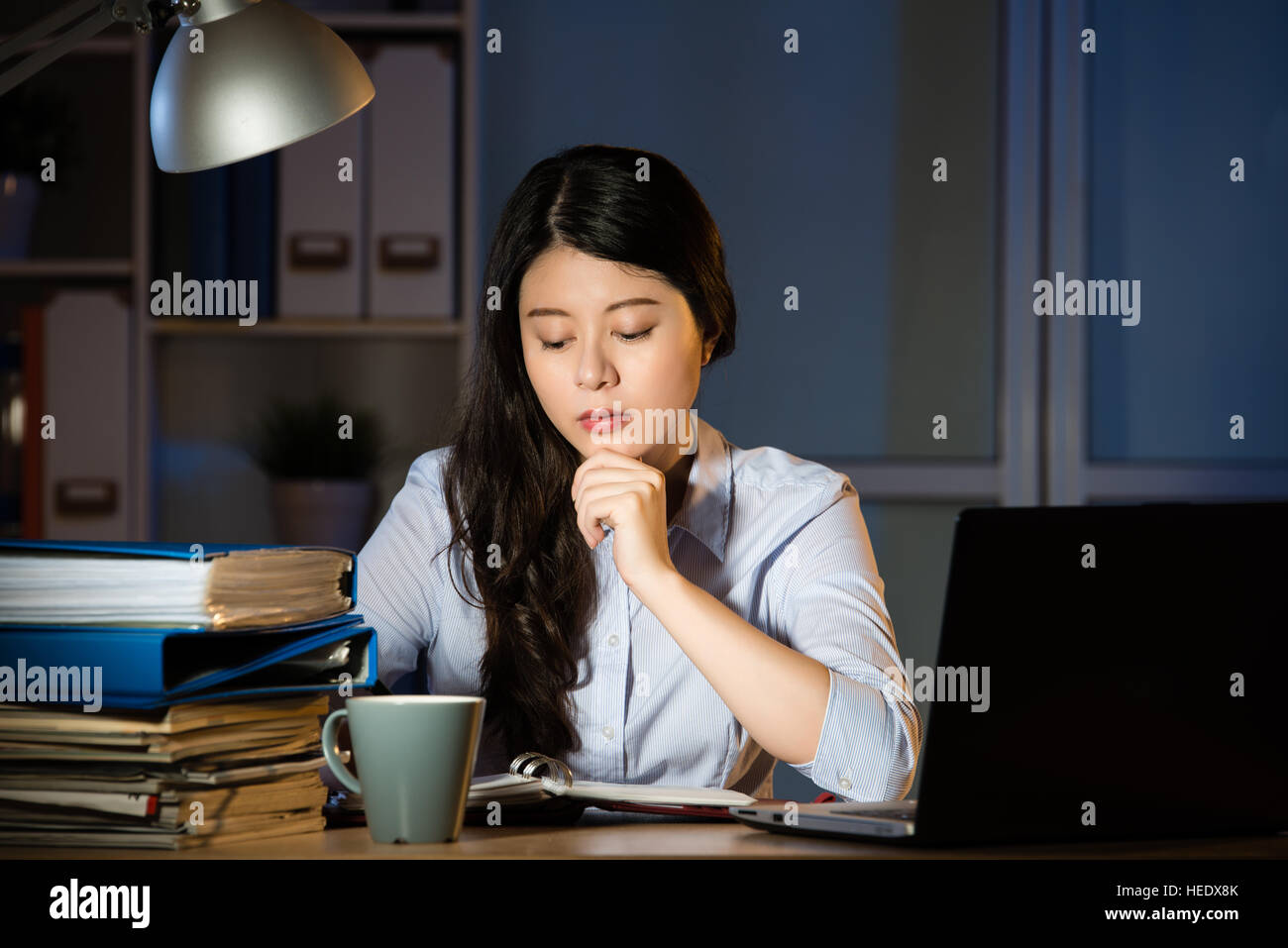 asian business woman sitting at desk working use laptop overtime late ...