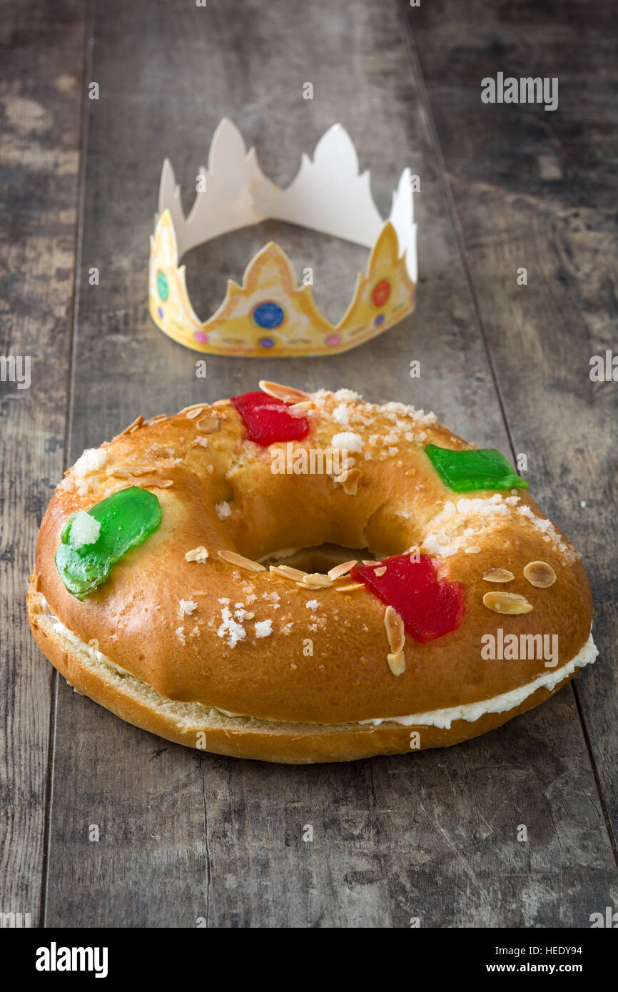 Spanish typical epiphany cake "Roscon de Reyes", on wooden background ...