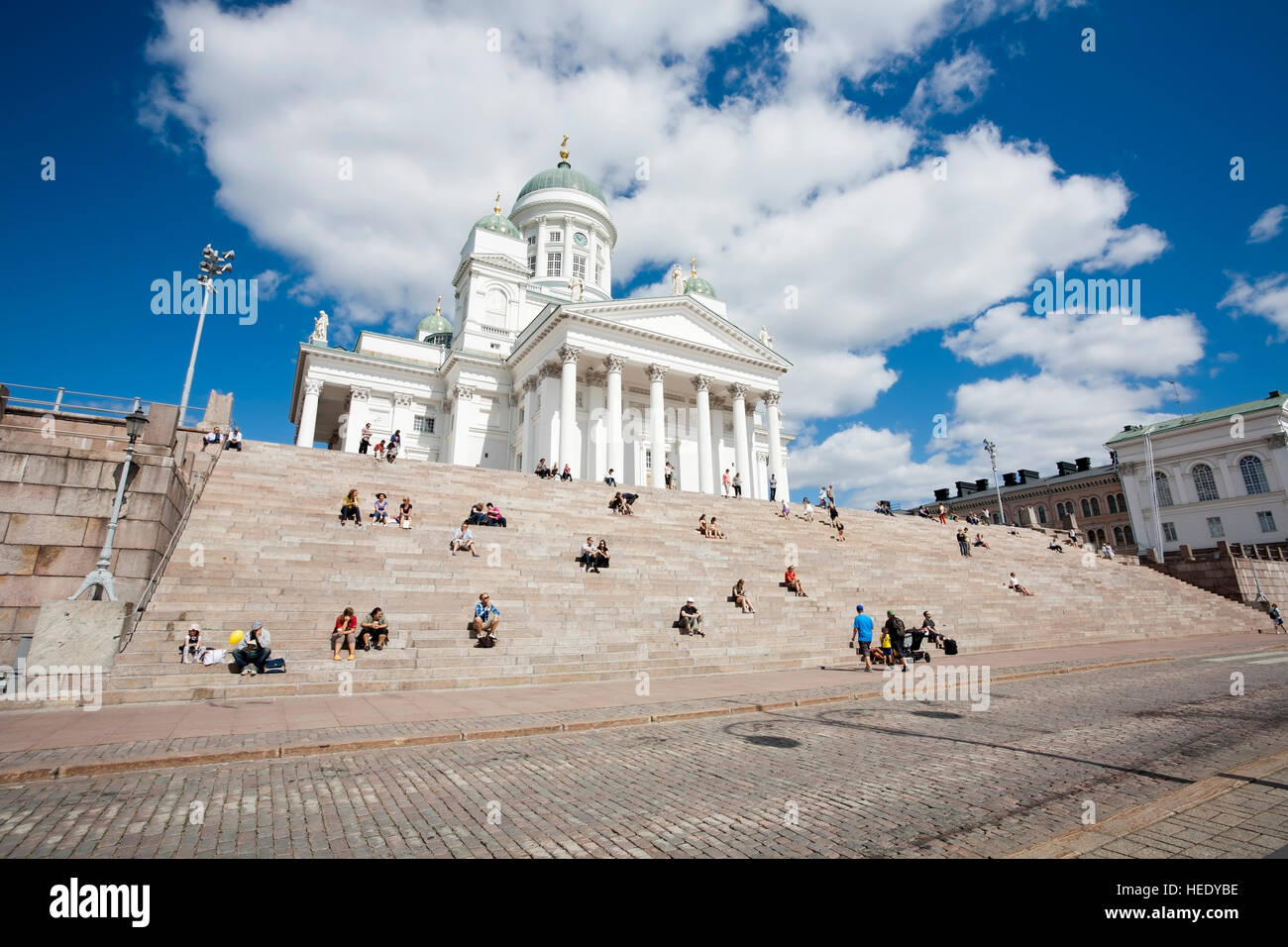 people sitting on Tuomiokirkko stairs, Helsinki Finland Stock Photo - Alamy