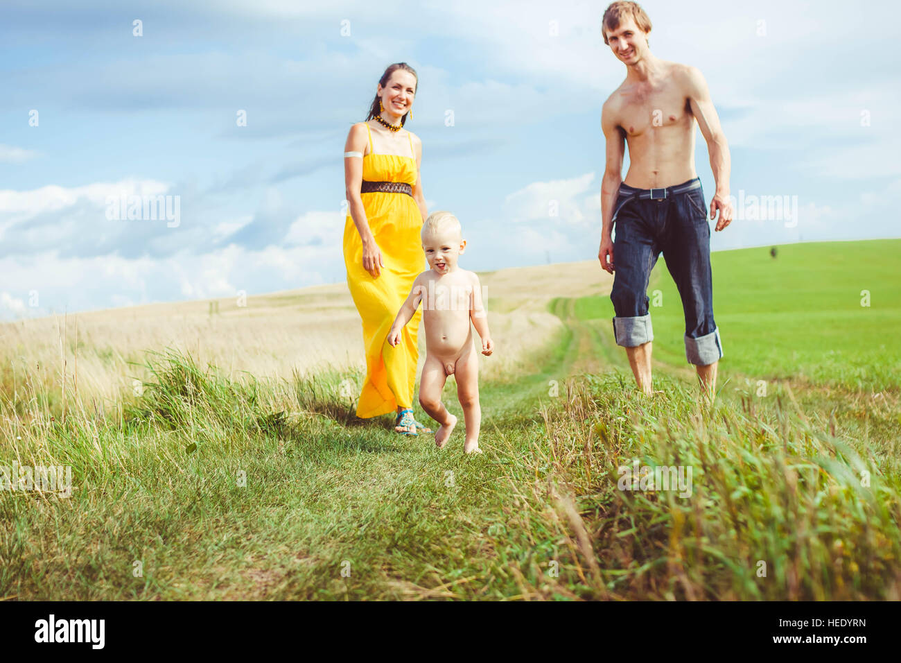 parents walking with baby in nature Stock Photo - Alamy