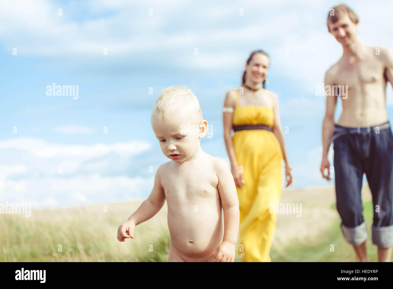 child running in a field Stock Photo - Alamy