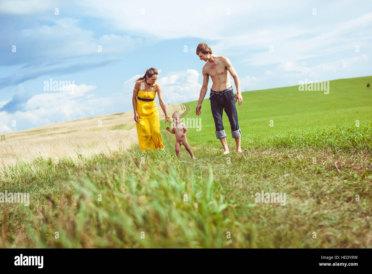 parents walking with baby in nature Stock Photo - Alamy