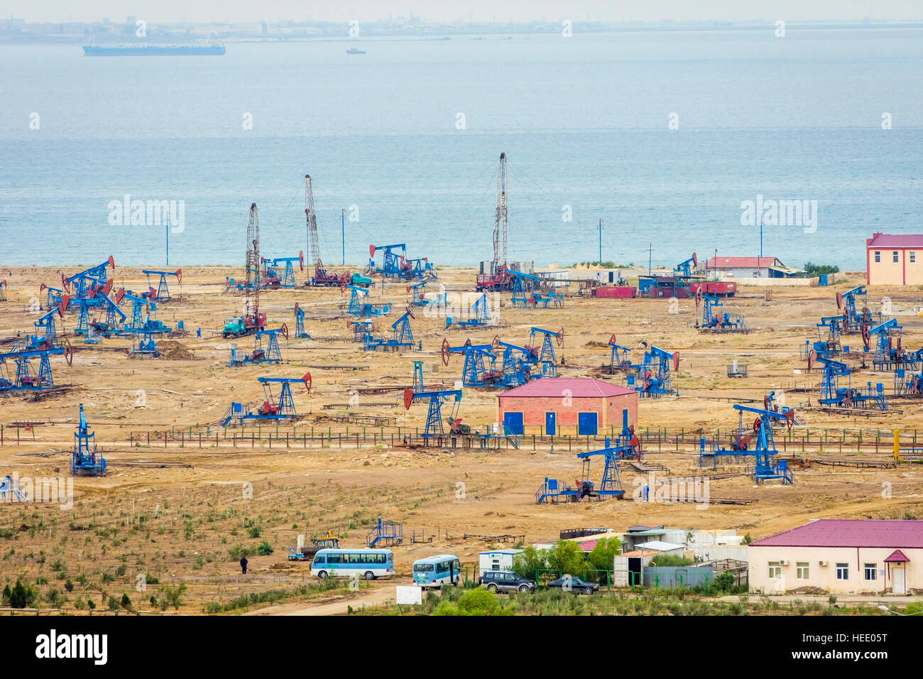 Oil pumps and rigs at the field by Caspian sea near Baku, Azerbaijan ...