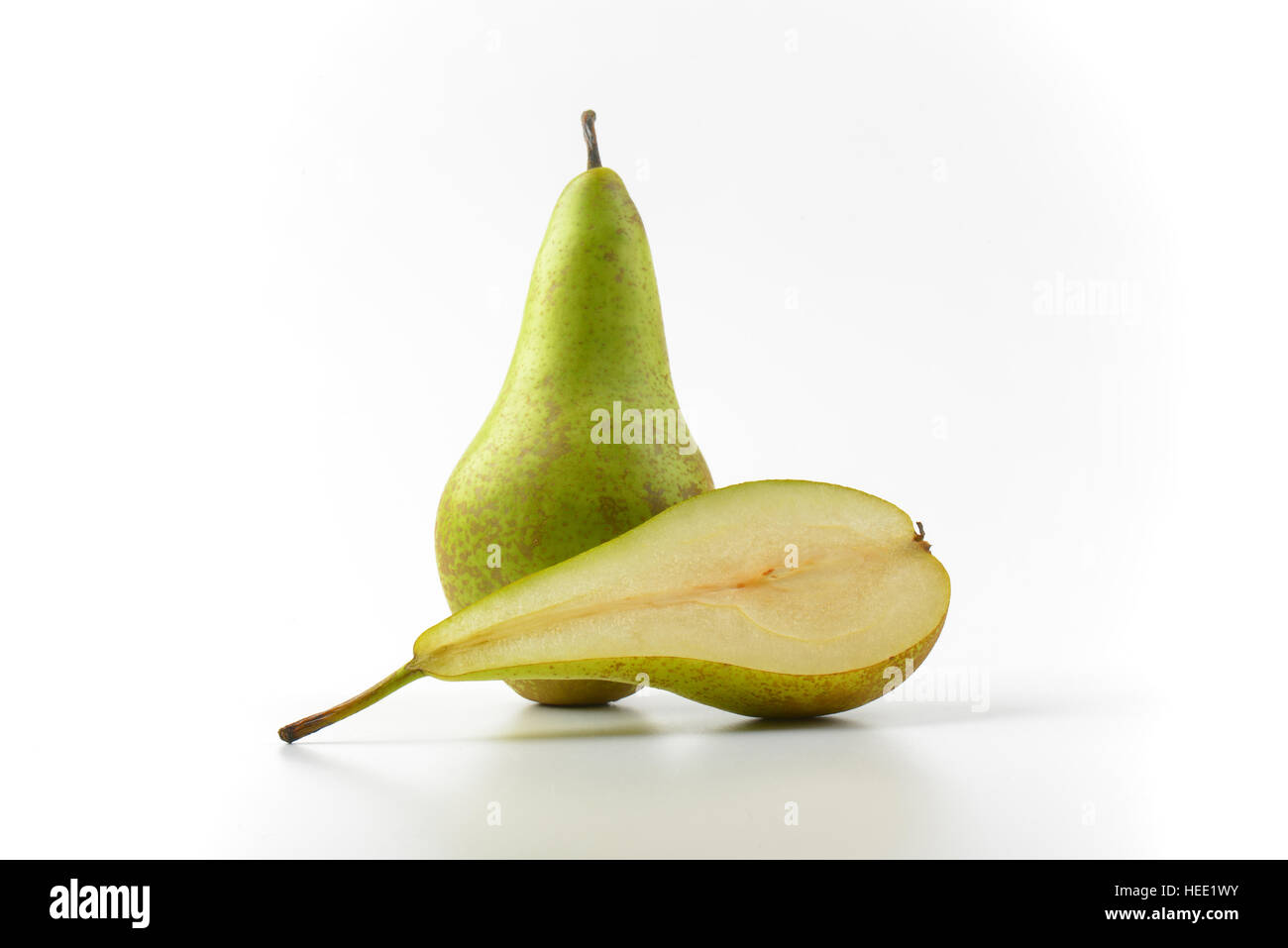 one whole pear and a half (cross section Stock Photo - Alamy