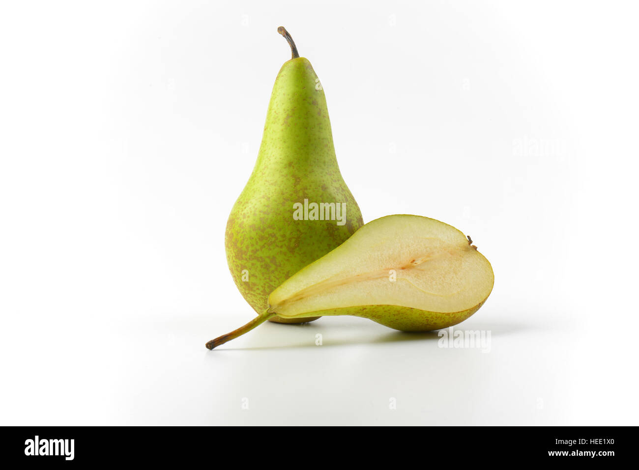 one whole pear and a half (cross section Stock Photo - Alamy