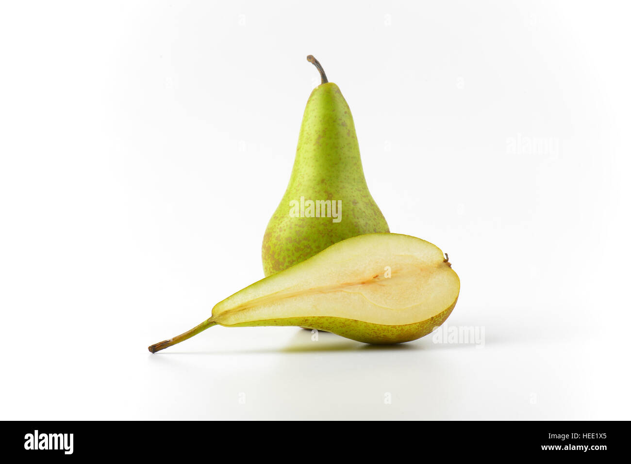 one whole pear and a half (cross section Stock Photo - Alamy