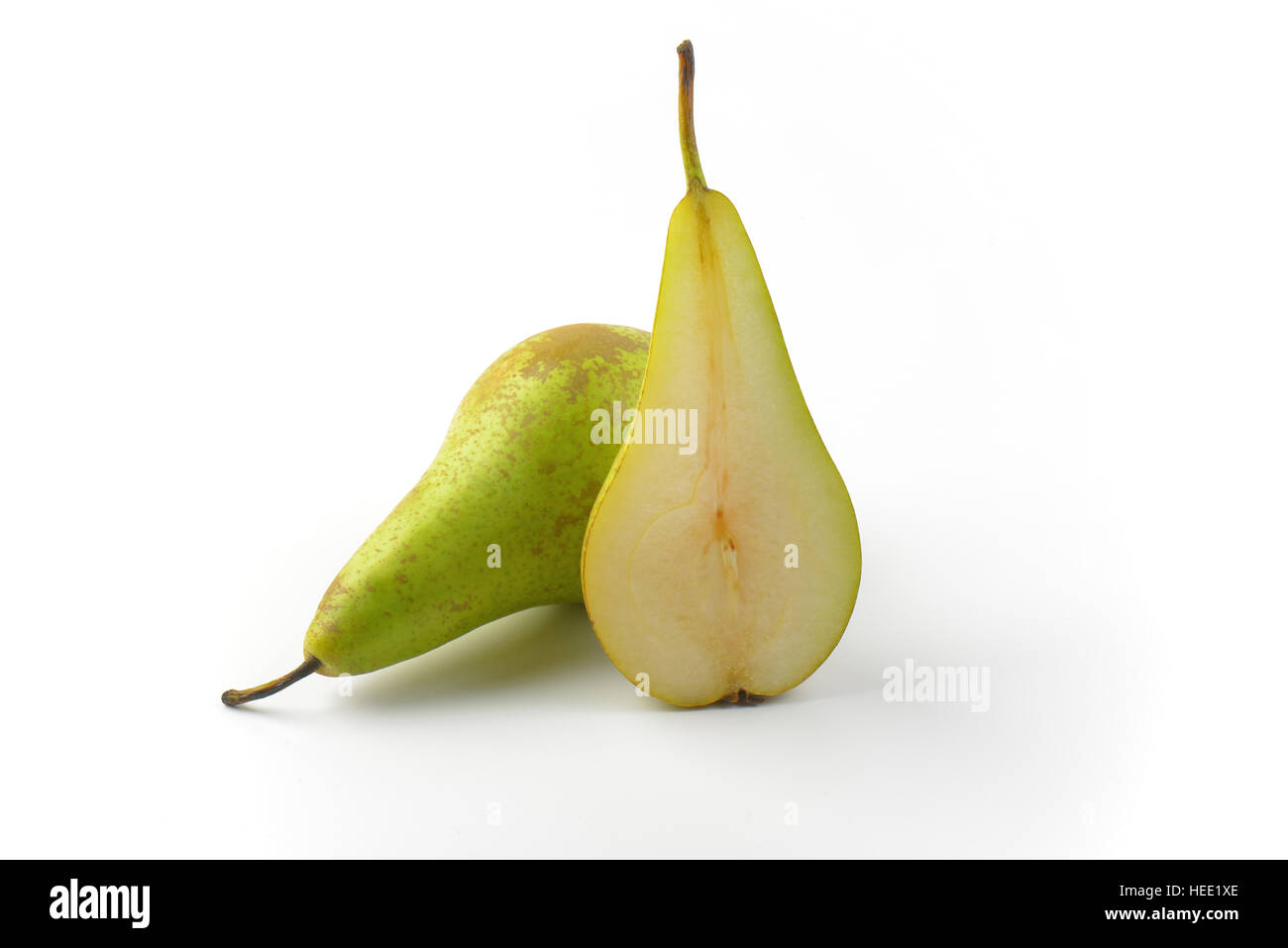 one whole pear and a half (cross section Stock Photo - Alamy