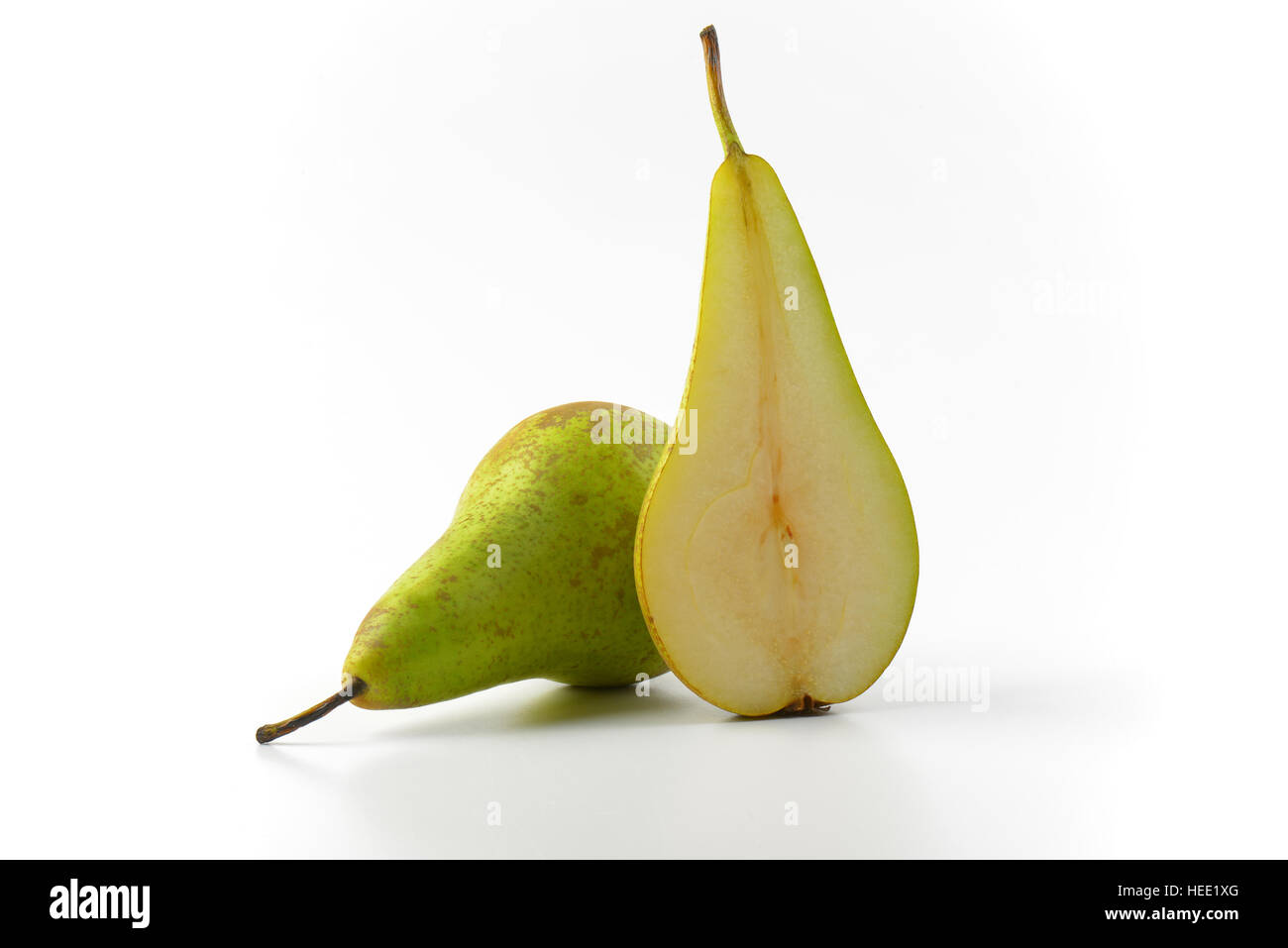 one whole pear and a half (cross section Stock Photo - Alamy