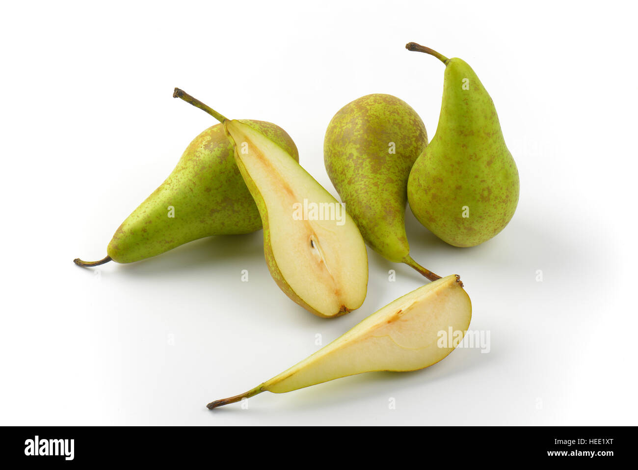 three whole pears, half a pear and slice Stock Photo - Alamy