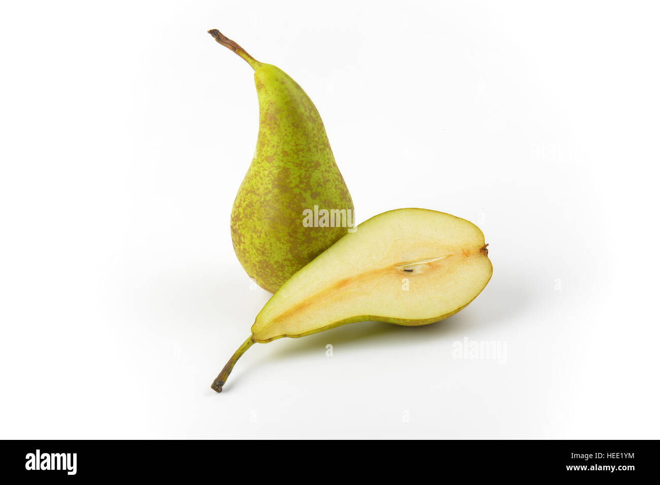 one whole pear and a half (cross section Stock Photo - Alamy