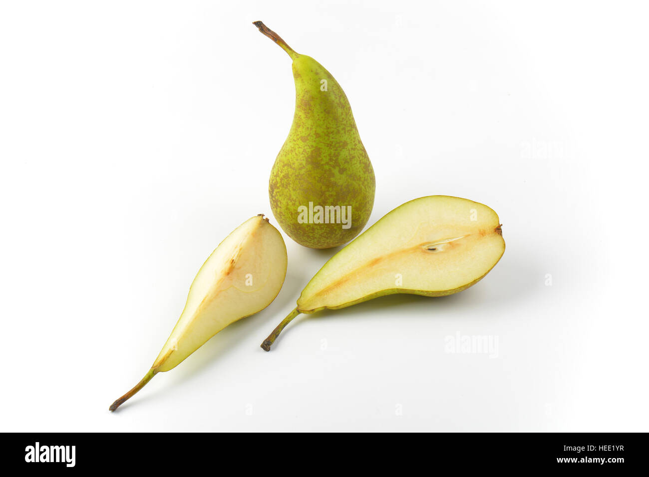 one whole pear, one half a pear and slice Stock Photo - Alamy