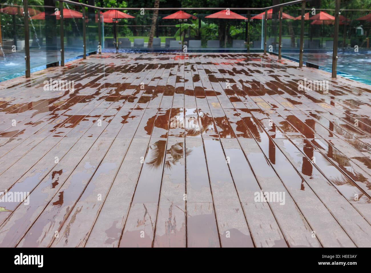 Wet outdoor floor/decking beside swimming pool after raining Stock ...