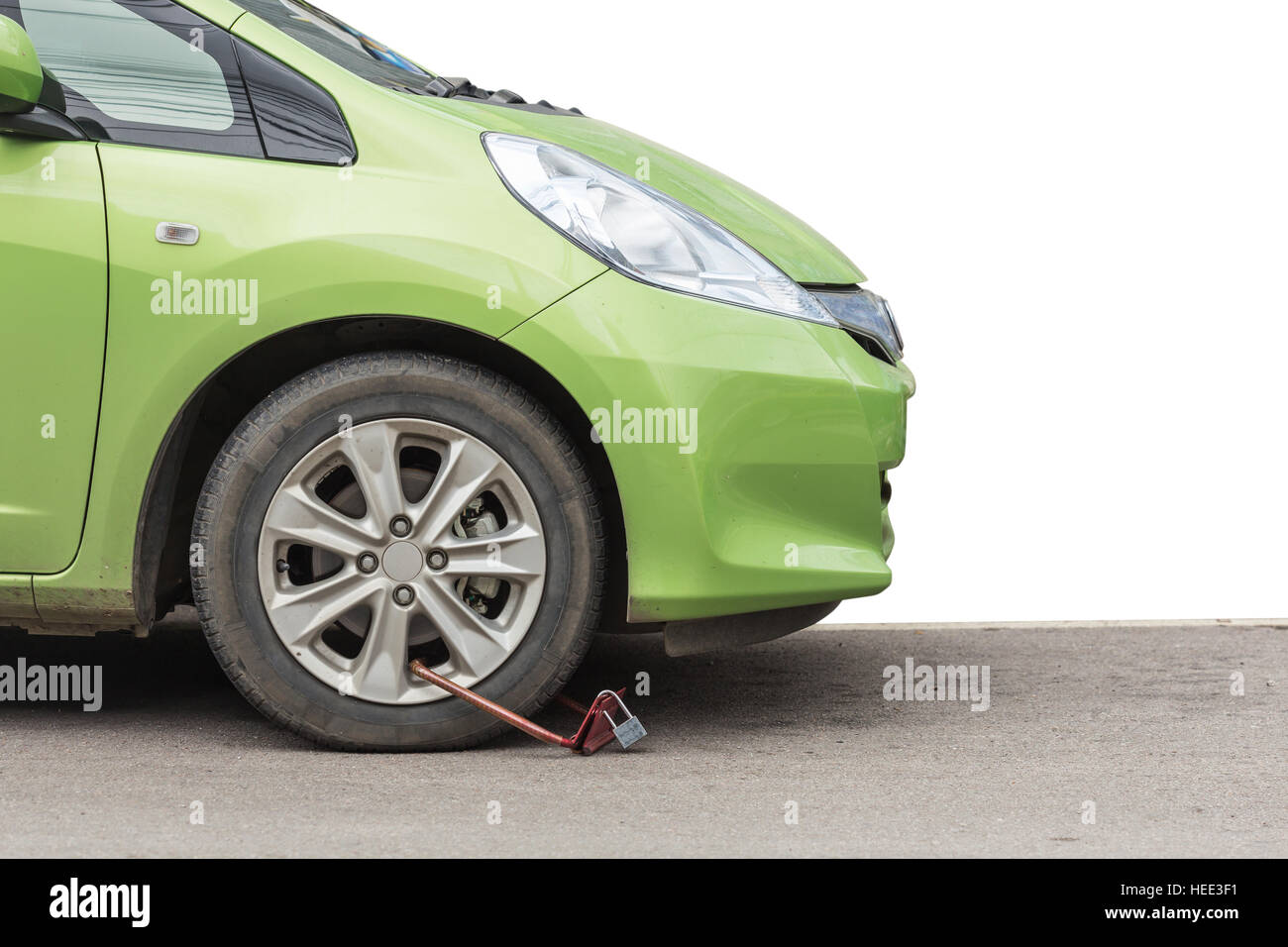 Front wheel of car get locked by police on the road isolated on white ...