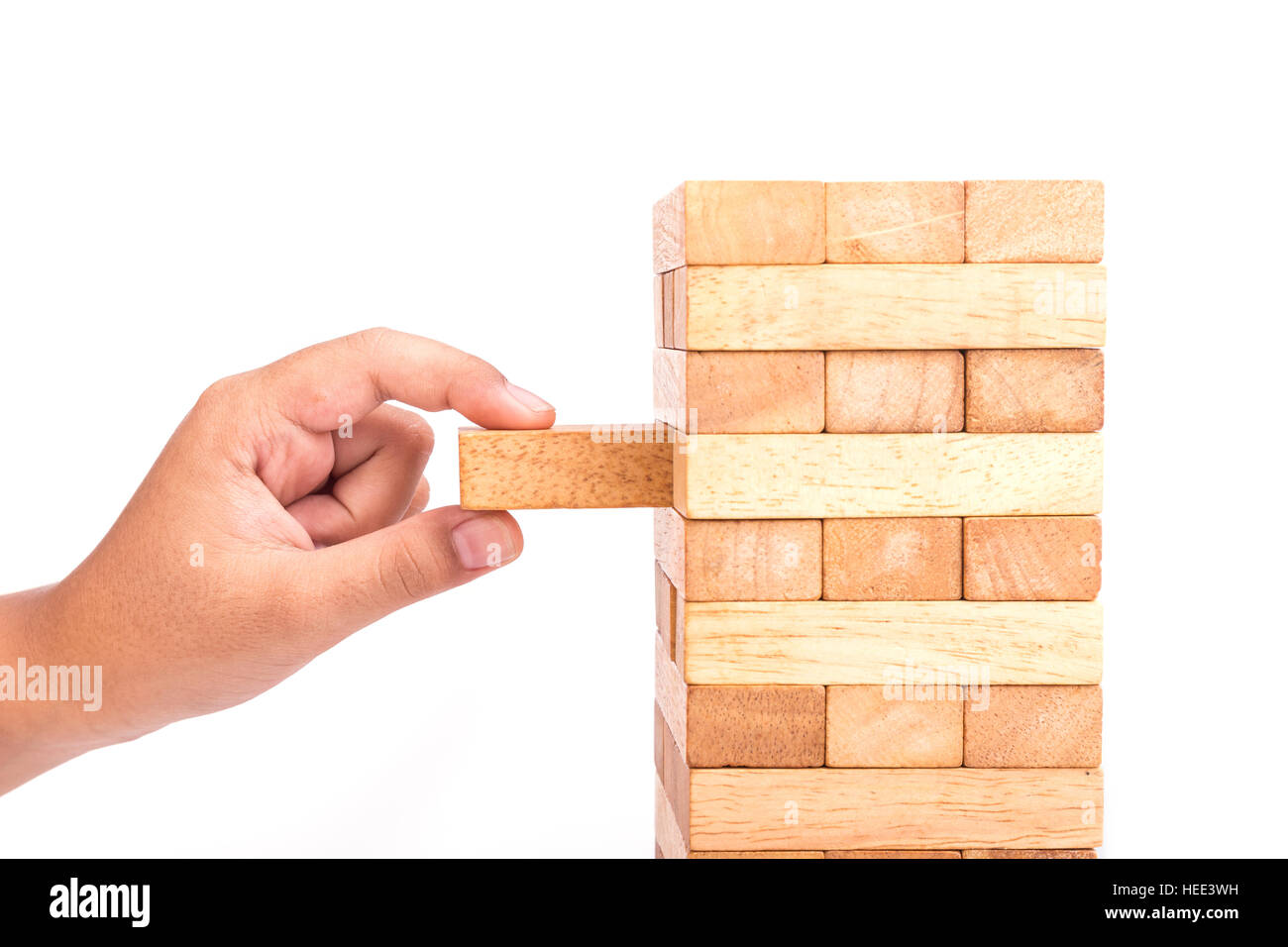 Close up hand holding blocks wood game (jenga) isolated on white ...