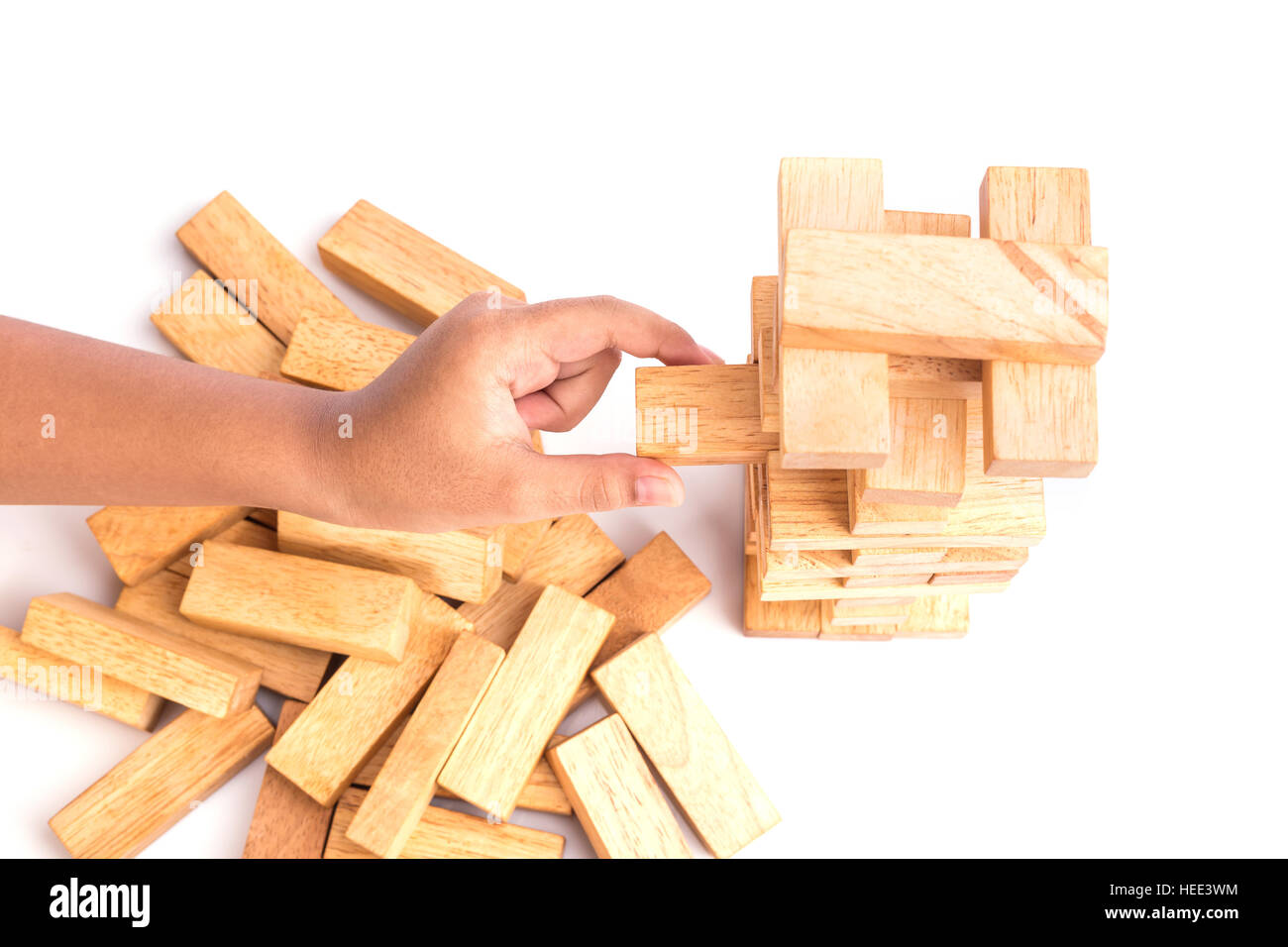Close up hand holding blocks wood game (jenga) isolated on white ...