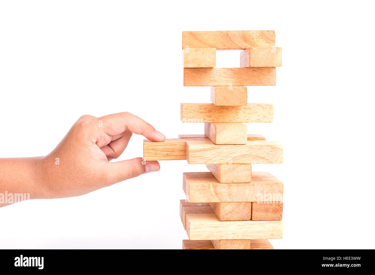Close up hand holding blocks wood game (jenga) isolated on white ...