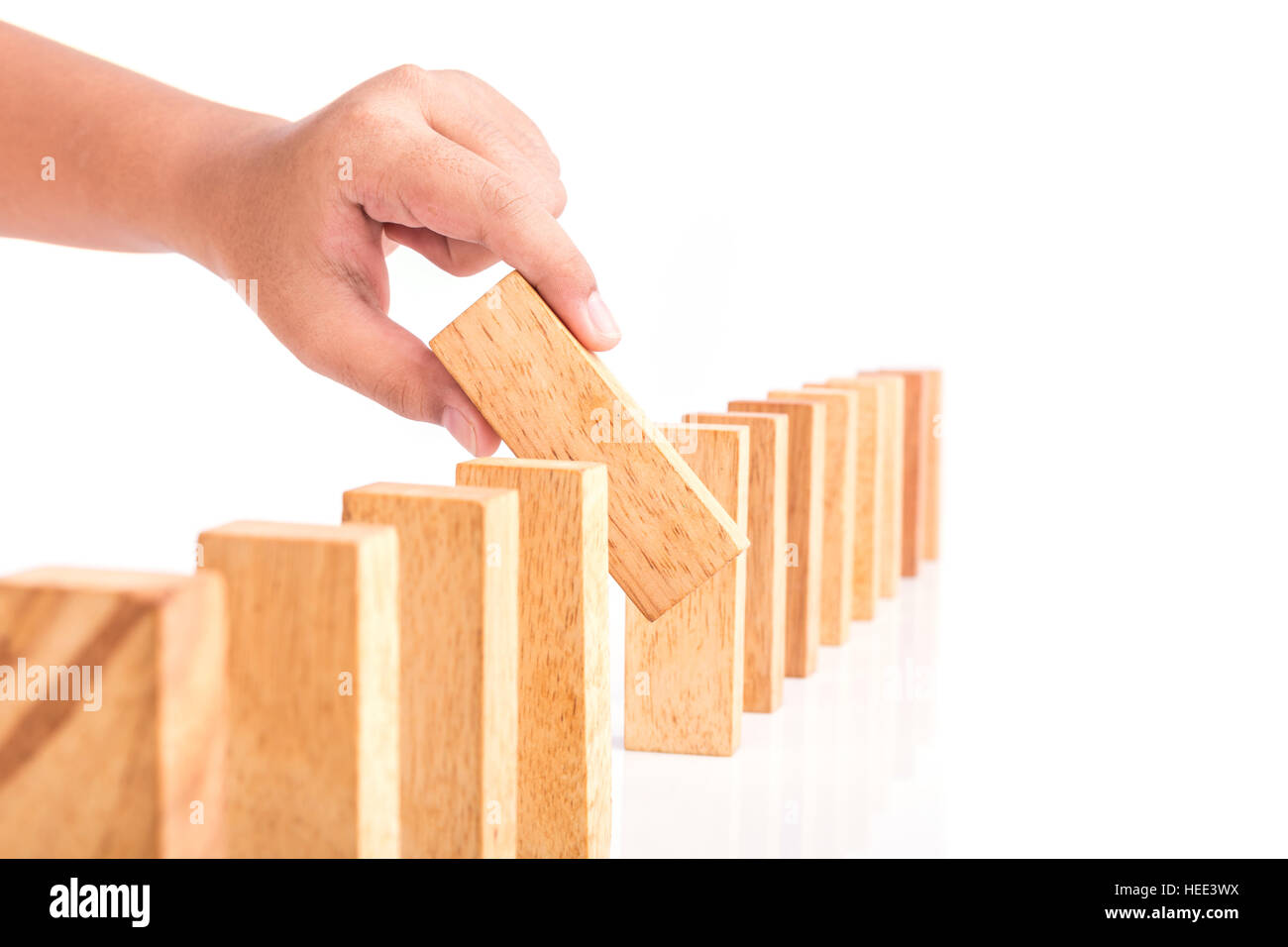 Close up hand holding blocks wood game (jenga) isolated on white ...