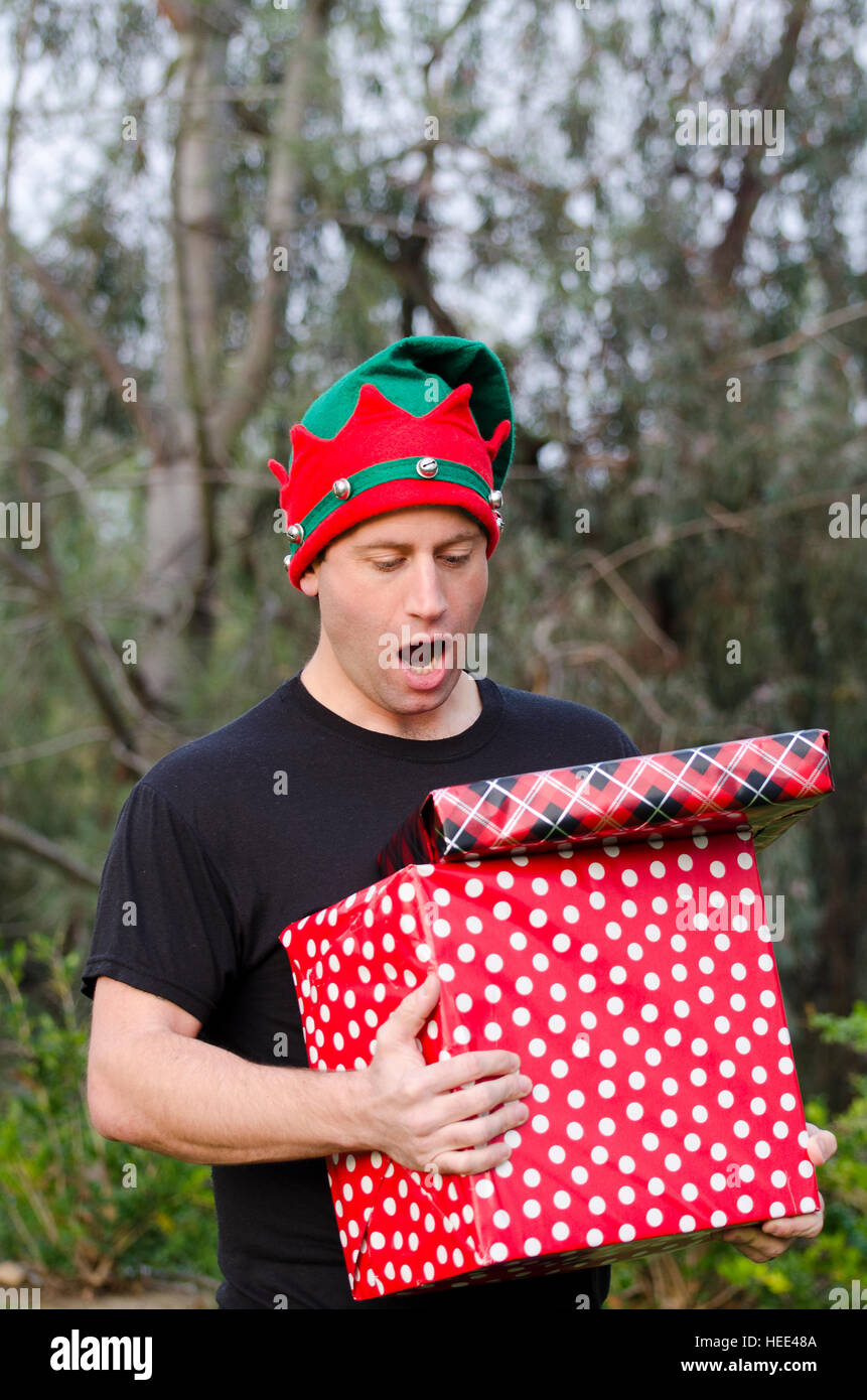 Surprised man holding jaw hi-res stock photography and images - Alamy