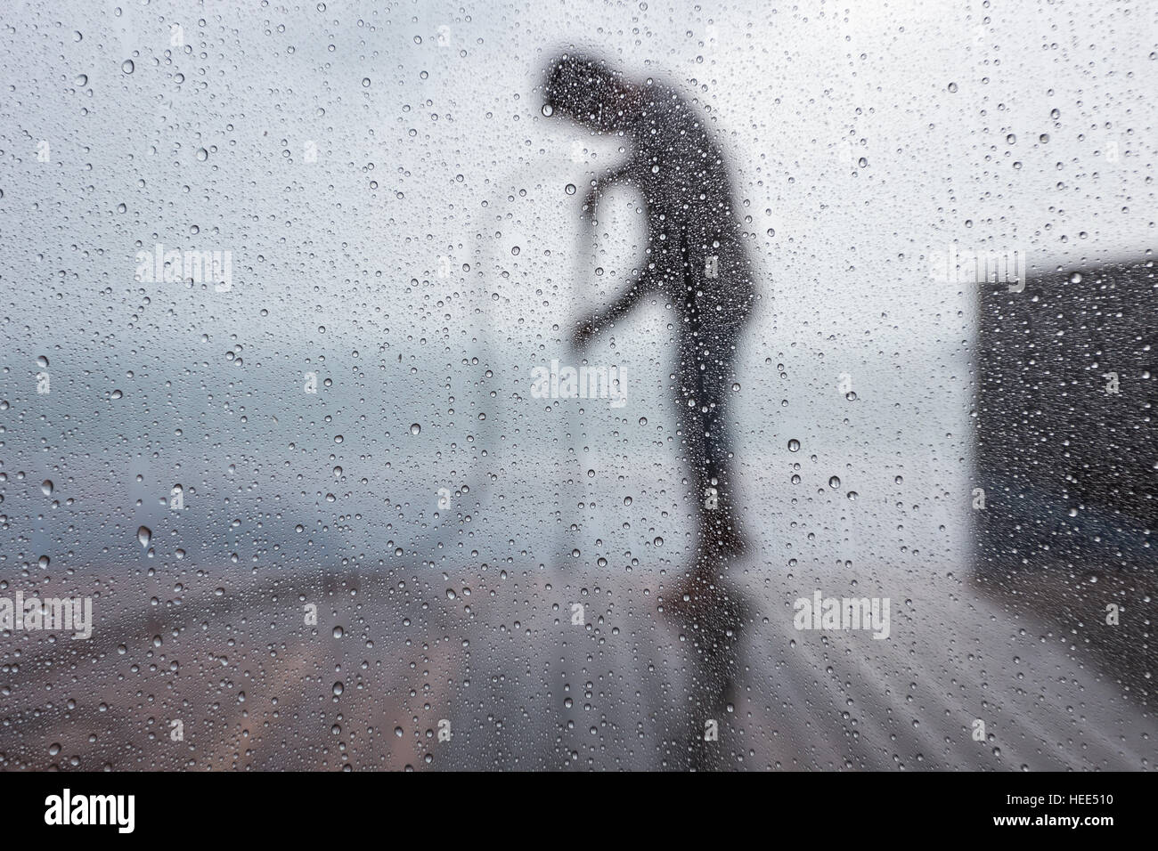 Abstract of blurred people washing decking by pressure wash. Focus on ...