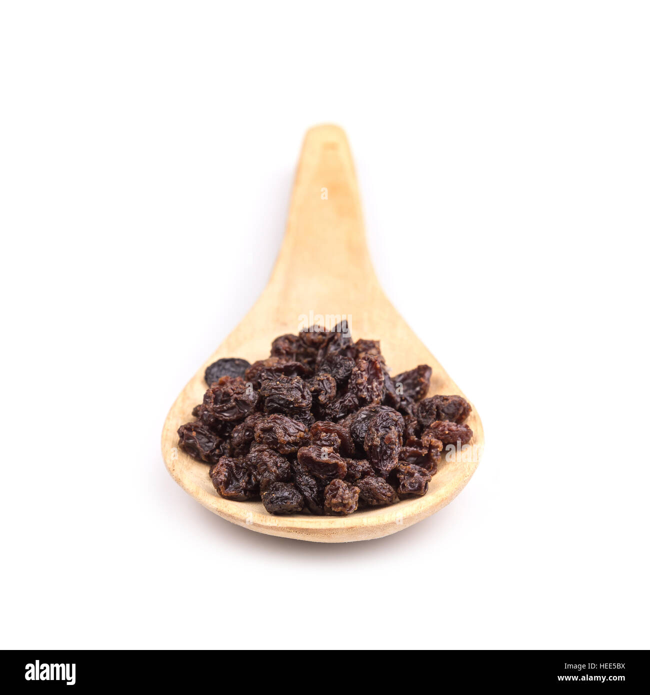 Close up raisin in wooden spoon isolated on white background Stock ...
