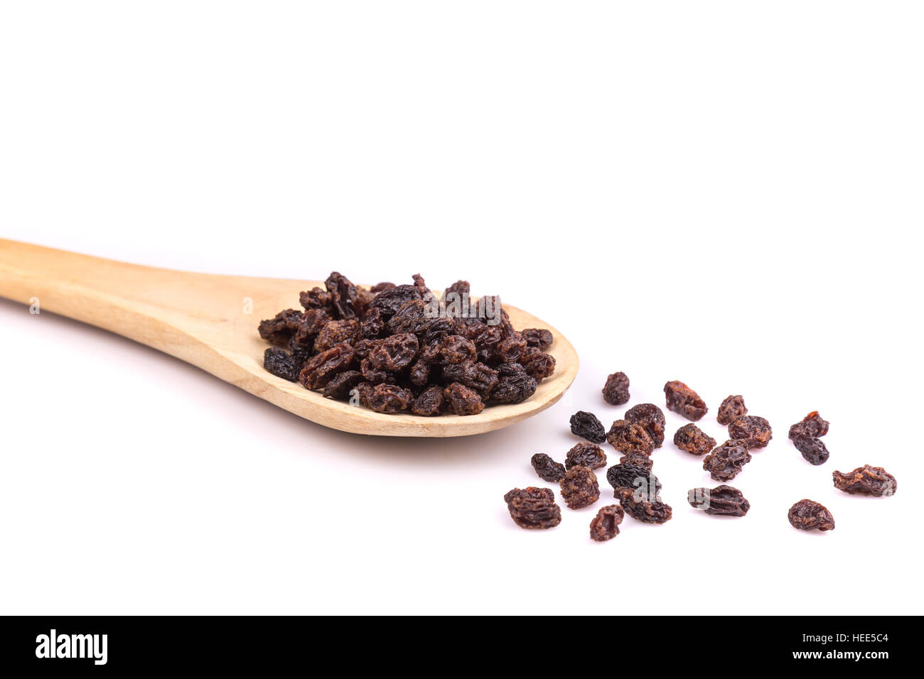 Close up raisin in wooden spoon isolated on white background Stock ...