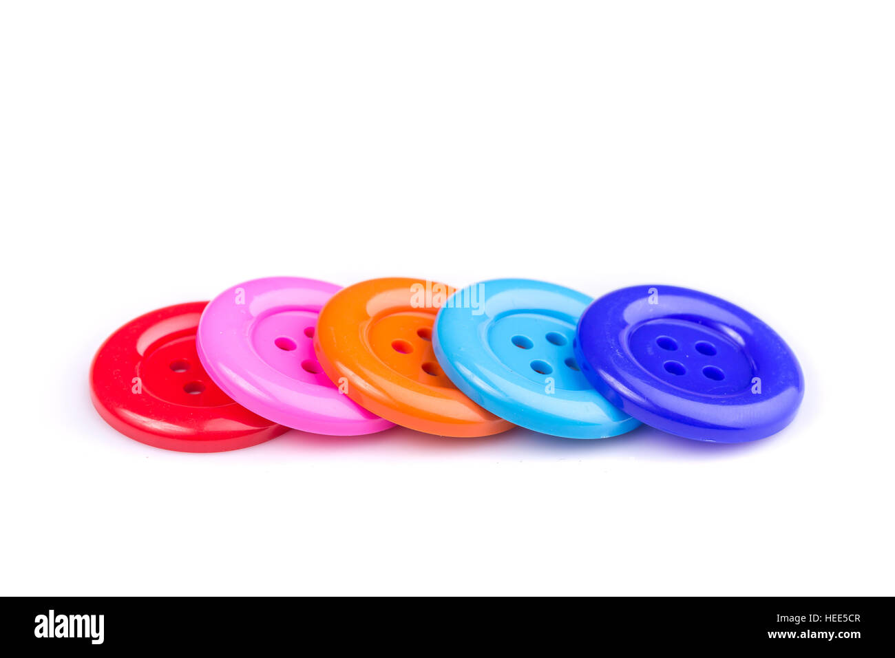 Close up color button isolated on white background Stock Photo - Alamy