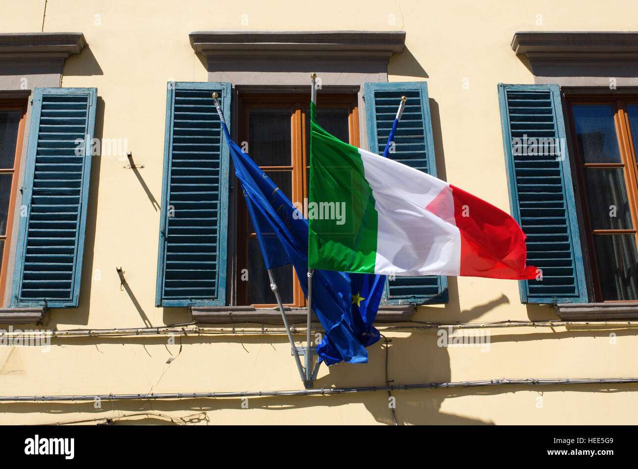old Italian house with national flag in front of the windows Stock ...