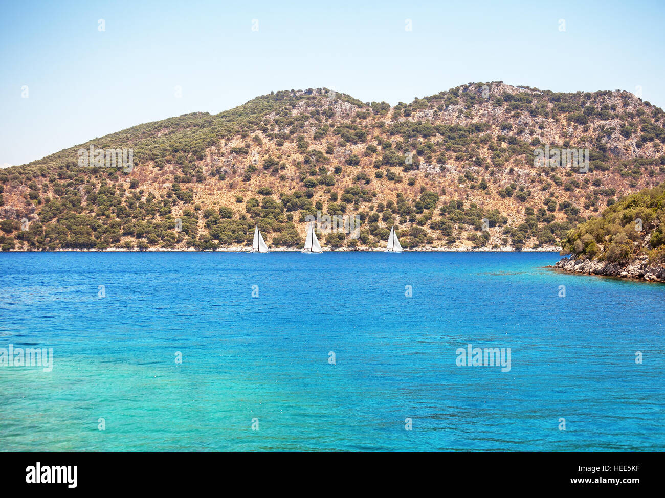 Recreation concept. Sea bay with turquoise water and white sailboats ...