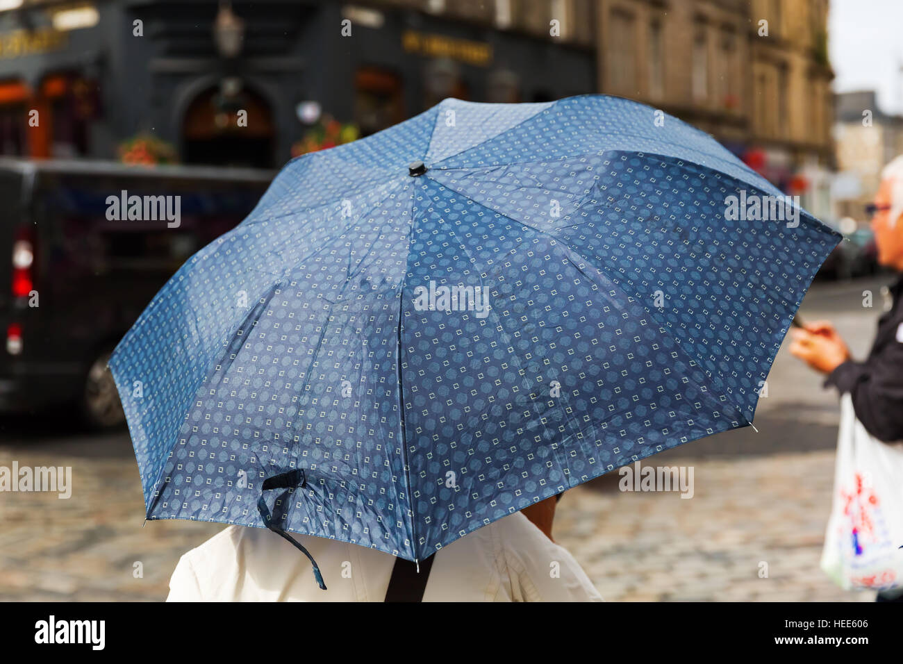 person with rain umbrella in the rainy city Stock Photo - Alamy