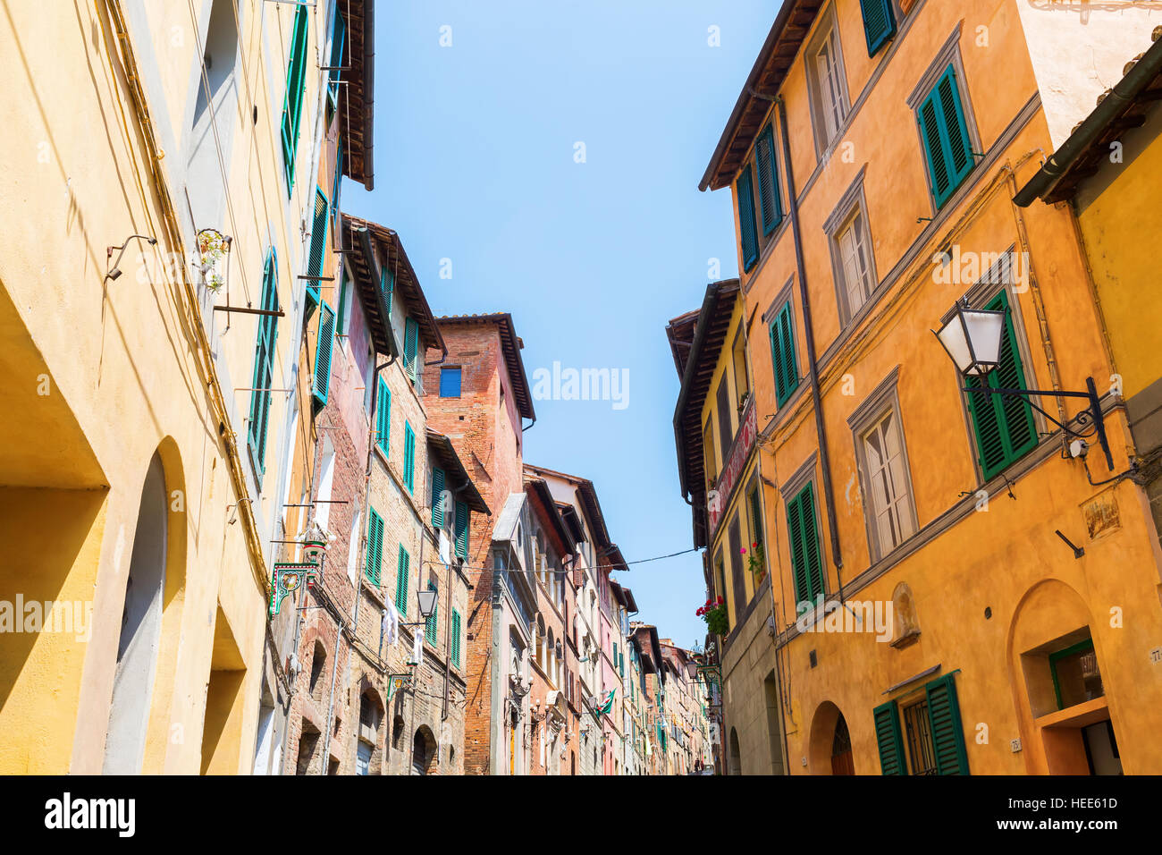 picturesque alley with old buildings in Siena, Tuscany, Italy Stock ...