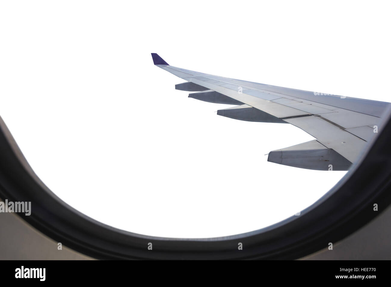 Wing of airplane from window isolated on white background. Saved with ...
