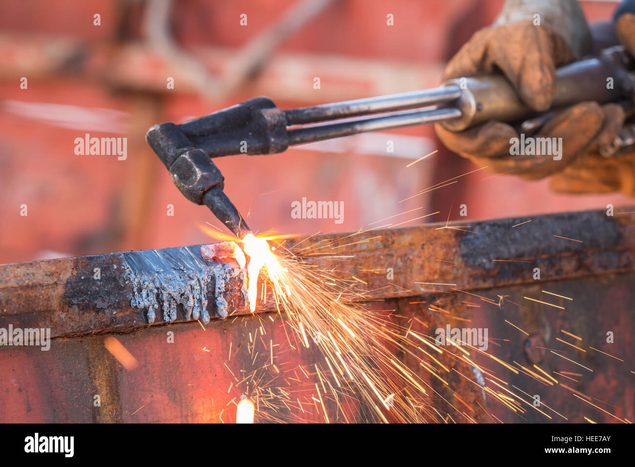A worker cutting steel using metal torch Stock Photo - Alamy