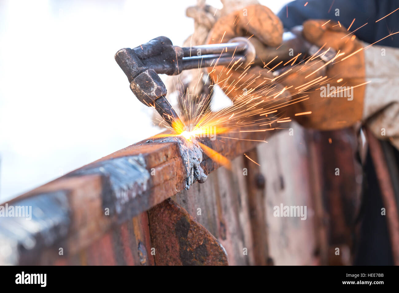 A worker cutting steel using metal torch Stock Photo - Alamy