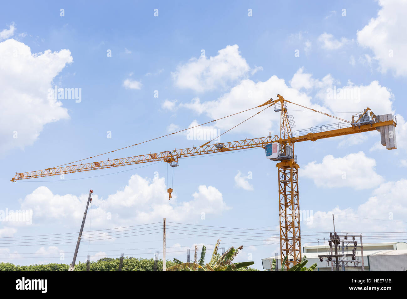 Big construction crane and the building against the sky background ...