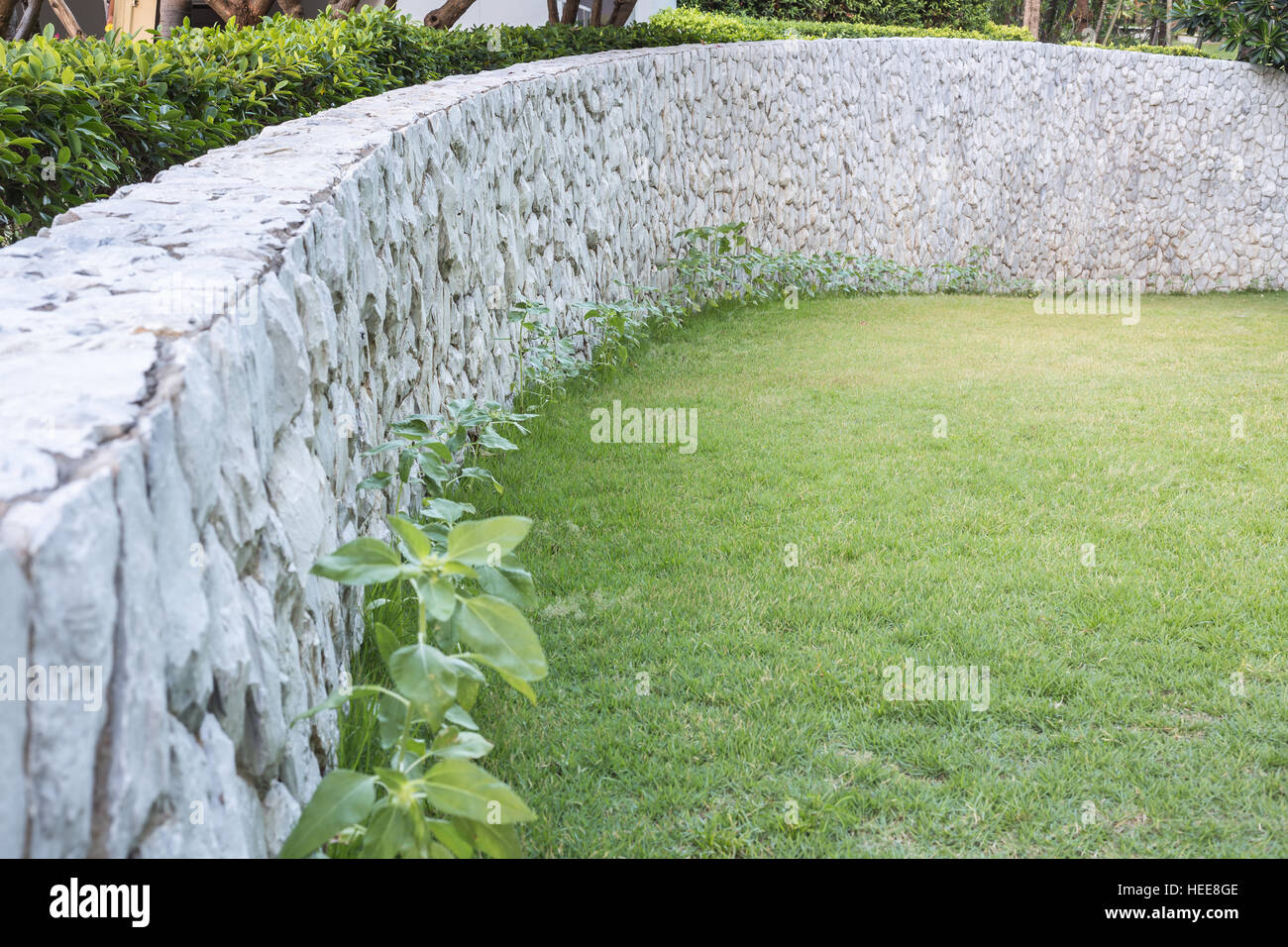 Exterior natural stone wall decorative in the garden Stock Photo - Alamy