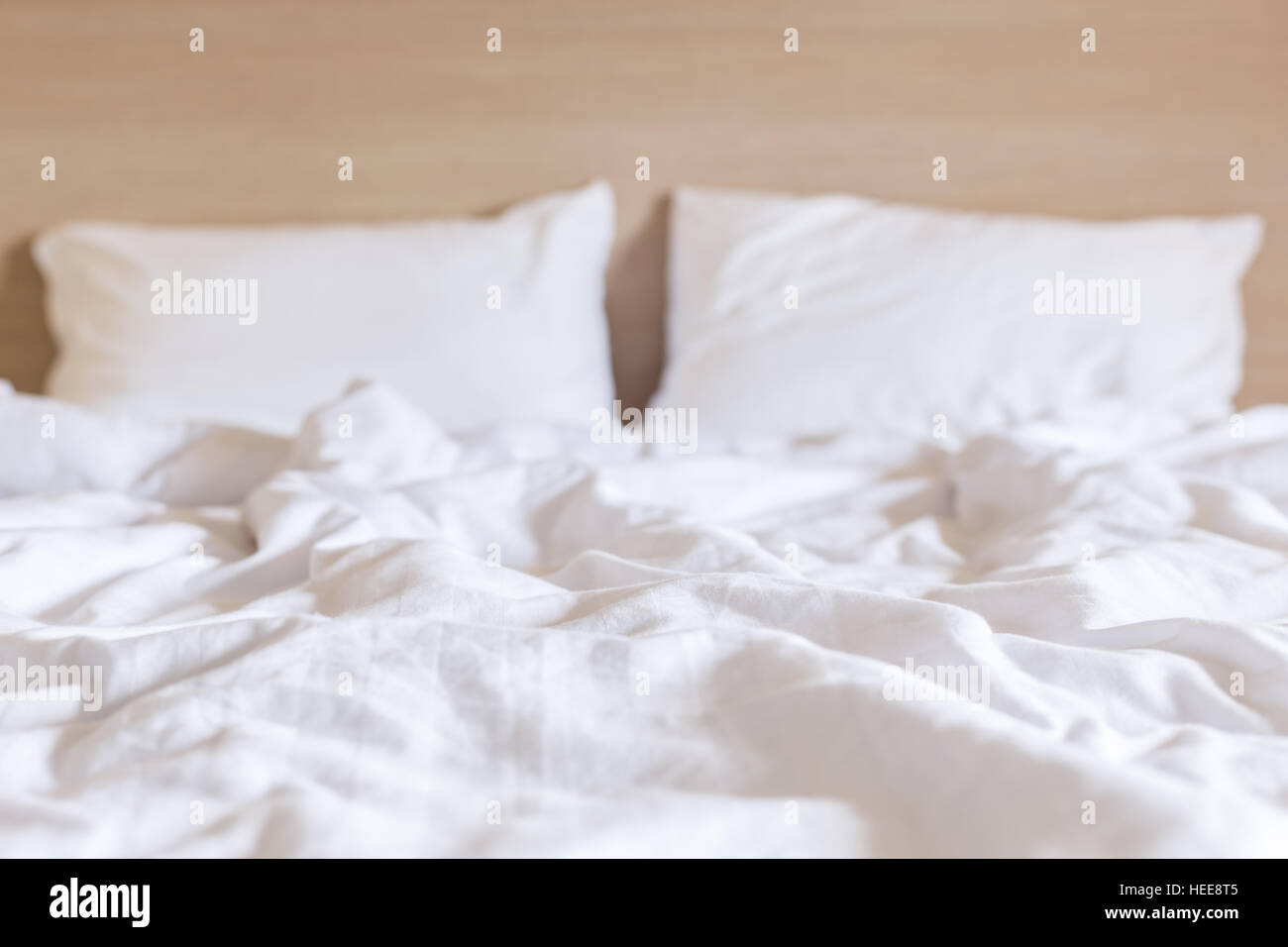 Close up white bedding sheets and pillow, Messy bed concept Stock Photo ...
