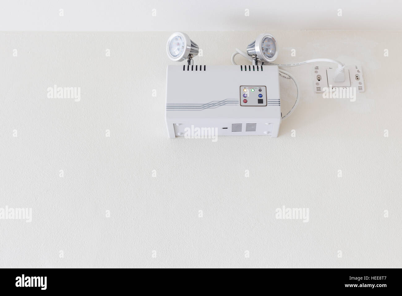 White Emergency Light setting on the wall in hotel Stock Photo - Alamy
