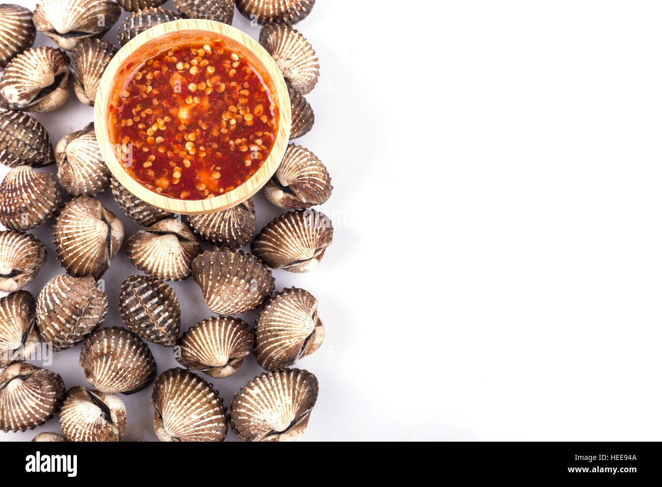 Close up boiled blood cockle with sauce isolated on white background ...