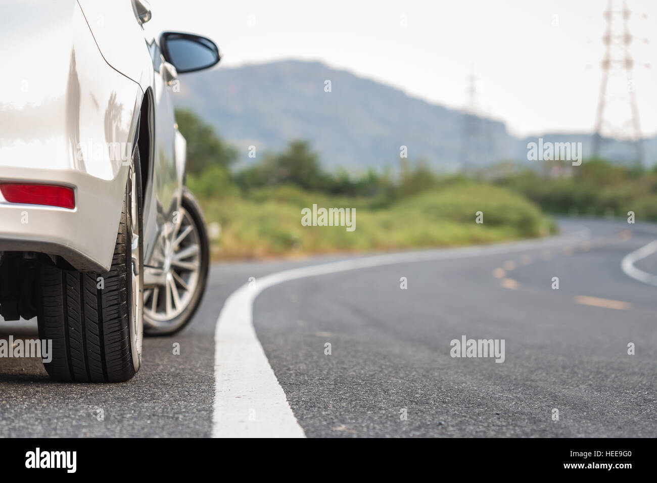 Close up back side of new silver car parking on the asphalt road Stock ...