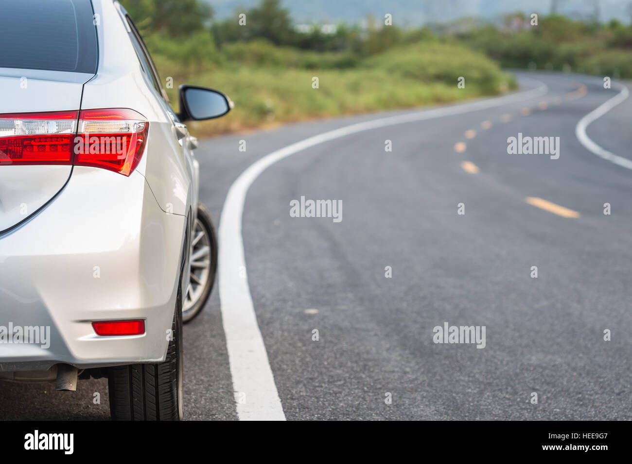 Close up back side of new silver car parking on the asphalt road Stock ...